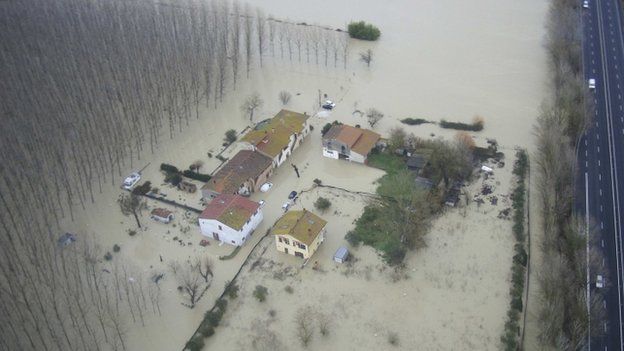 Italy battles floods as bad weather batters Europe - BBC News