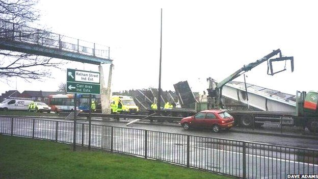 Doncaster footbridge collapses after being hit by crane on lorry - BBC News