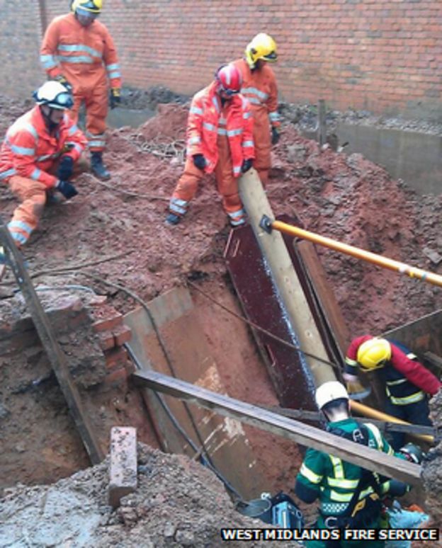 Trapped man rescued from trench in Bearwood - BBC News