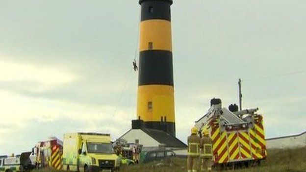 Killough: Painter rescued after getting stuck halfway up lighthouse ...