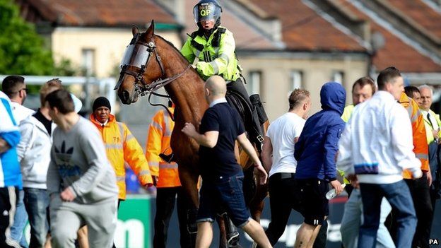 Pitch invasion arrests after Bristol Rovers relegation - BBC News