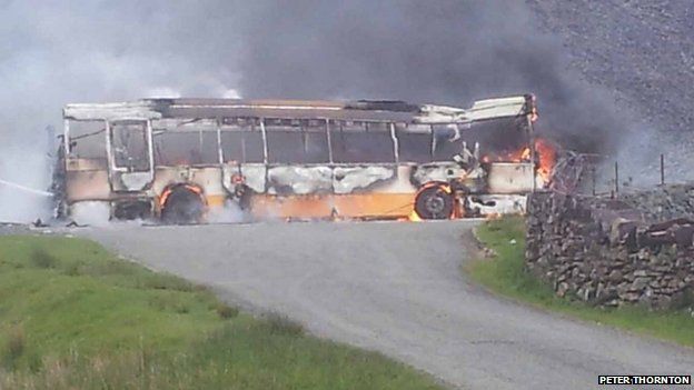 Passengers flee as bus gutted by fire near Caernarfon - BBC News