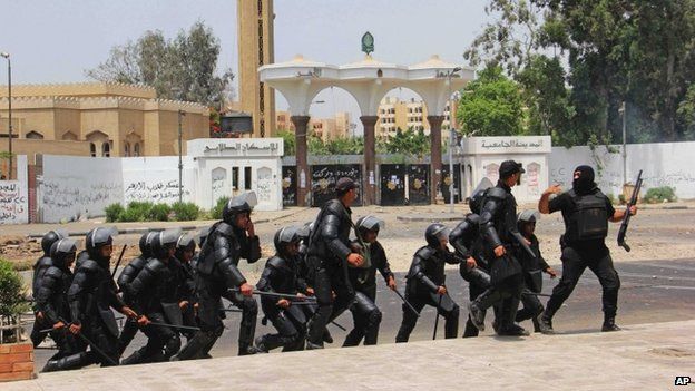 Egyptian policemen killed in Cairo drive-by shooting - BBC News