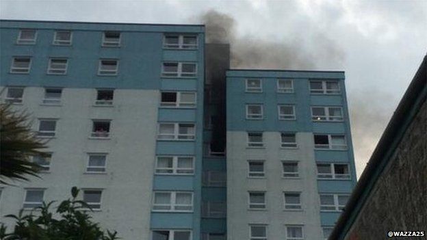 Fire erupts on ninth floor of St Austell tower block - BBC News