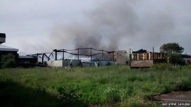 Brixham ex-holiday park fire: Five teenagers arrested - BBC News