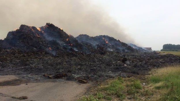 Waterbeach lightning strike haystack to 'burn for several days' - BBC News