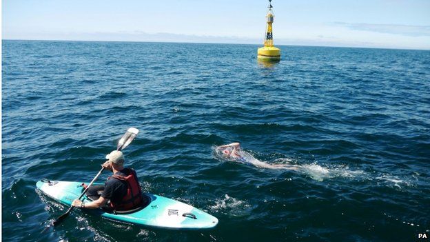 ME woman Beth French swims 26 miles to Scilly - BBC News