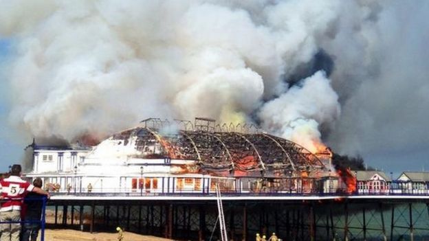 Fire rips through Eastbourne Pier destroying roof - BBC News