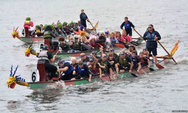 Hundreds join dragon boat race in Salford Quays - BBC News