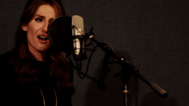 Disabled singer responds to childhood bullies in song - BBC News