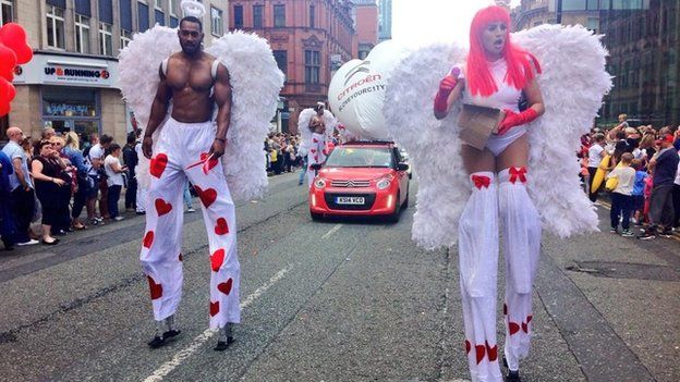 Thousands turn out for Manchester Pride parade - BBC News