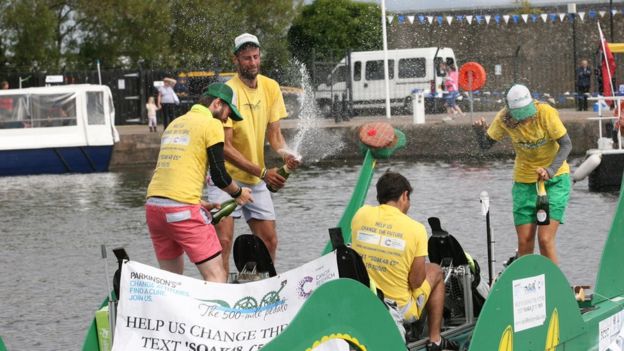 Four complete 500-mile challenge in Nessie pedalo - BBC News