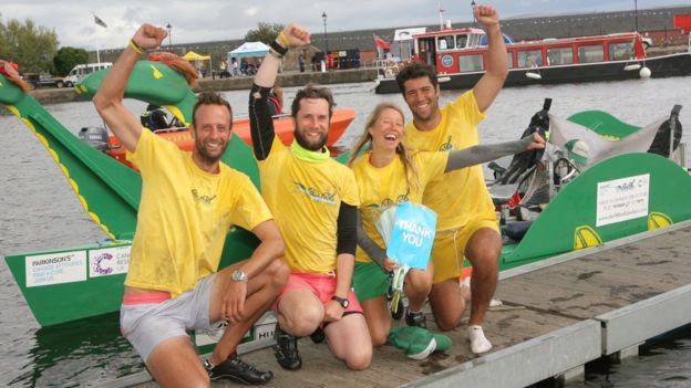 Four complete 500-mile challenge in Nessie pedalo - BBC News