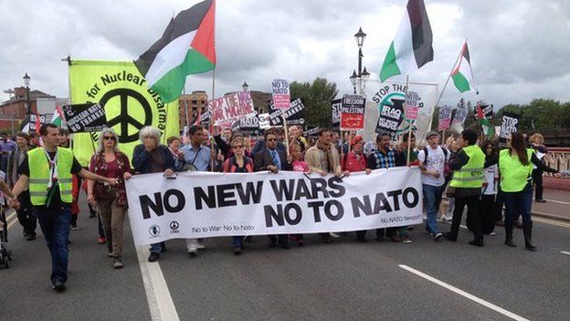 Hundreds join Nato protest march in Newport on Saturday - BBC News