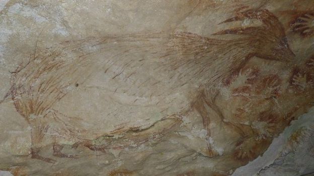 Indonesia: Archaeologists find world's oldest animal cave painting ...