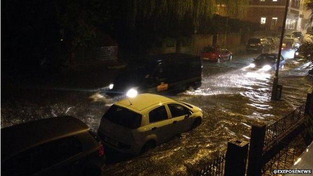 Exeter flooding sees elderly people evacuated from homes - BBC News