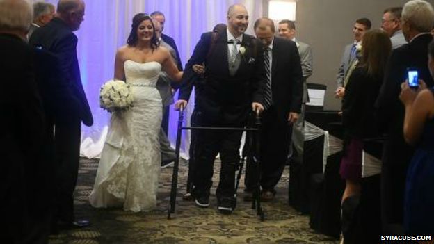 Paralysed groom walks down the aisle using robotic 'exoskeleton' - BBC News