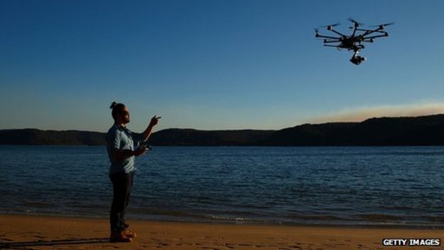Topless sunbather photographed by estate agent drone - BBC News