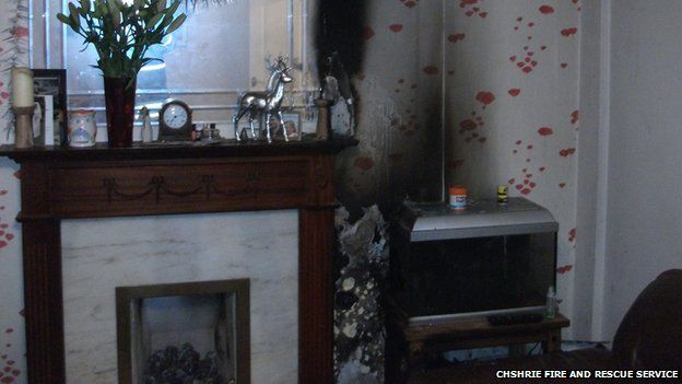 Shattered fish tank stops Warrington house fire - BBC News