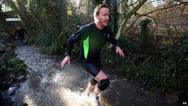 Prime Minister David Cameron runs in charity mud race - BBC News
