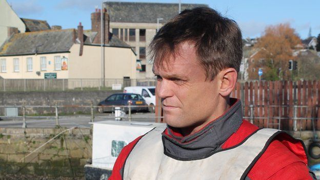 Man, 93, plunges 15ft into Truro river on mobility scooter - BBC News