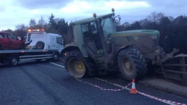 Tractor hanging off bridge closes A5 Chirk bypass, Wrexham - BBC News