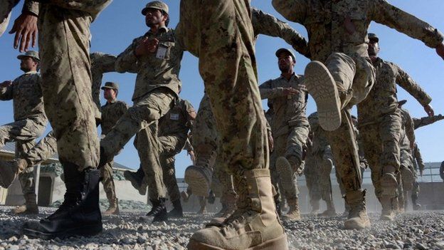 Afghan police killed in Taliban raid - BBC News