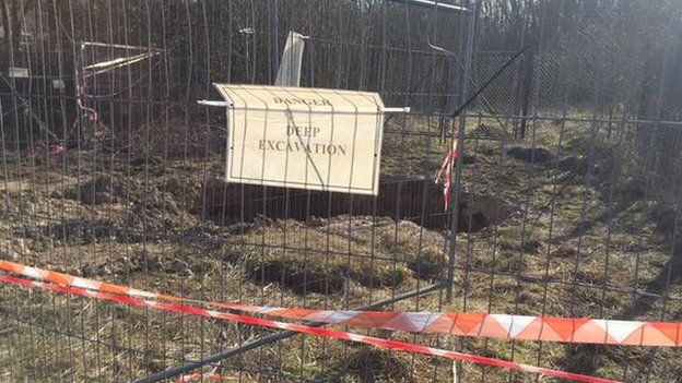 Hole appears next to The Mount prison in Bovingdon - BBC News