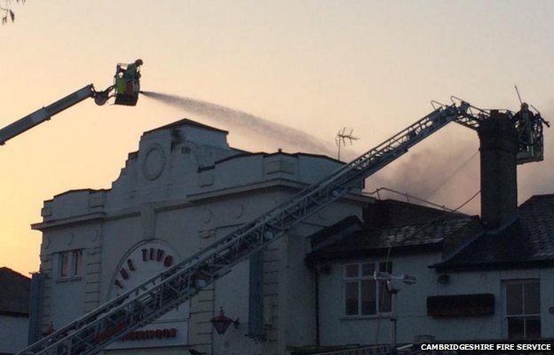 Cambridge Tivoli pub fire causes building collapse - BBC News
