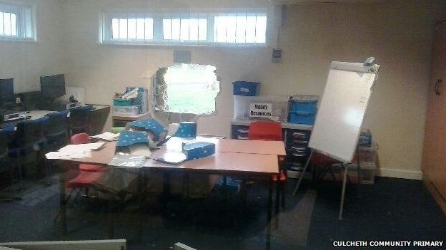 iPad thieves smash through wall at Culcheth school - BBC News