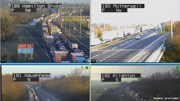 Driver hurt and travel delays as lorries crash on M74 motorway - BBC News