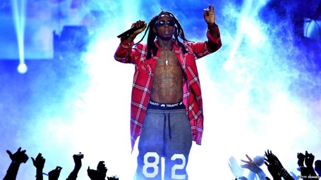 Lil Wayne's tour bus shot 'multiple times' after show - BBC News