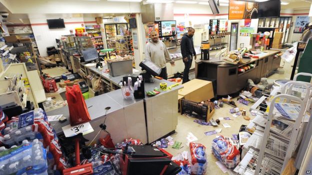 Baltimore: A night of rioting in pictures - BBC News