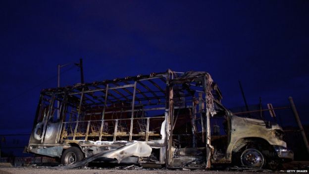 Baltimore: A night of rioting in pictures - BBC News