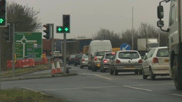 MPs angry as A55 and A483 roadworks deadlines missed - BBC News