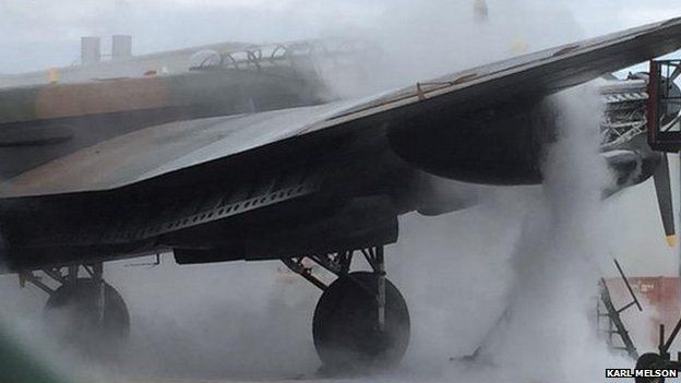 Lancaster bomber mid-air engine fire - BBC News