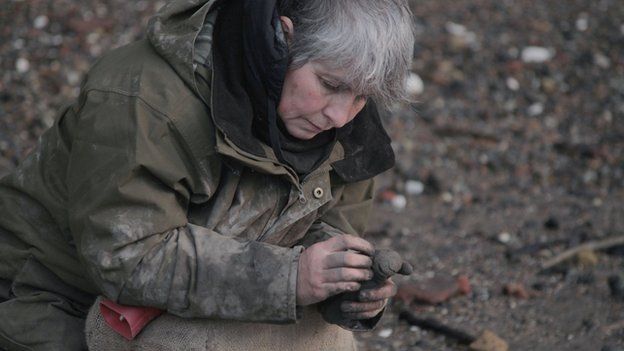 Artist Liz Crow's austerity mud figures ground up - BBC News