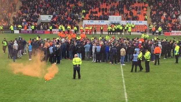 Blackpool FC: Police seek to identify fans after pitch invasion - BBC News