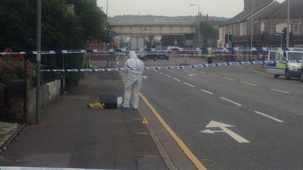 Police hunt man, 47, after woman stabbed in Cardiff - BBC News