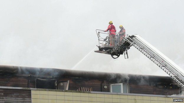 Wigan flats fire: Sixty homes destroyed in blaze - BBC News
