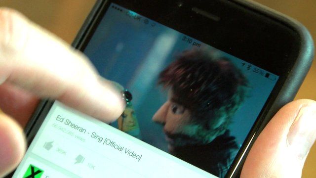 Spotify adds podcasts and video clips - BBC News