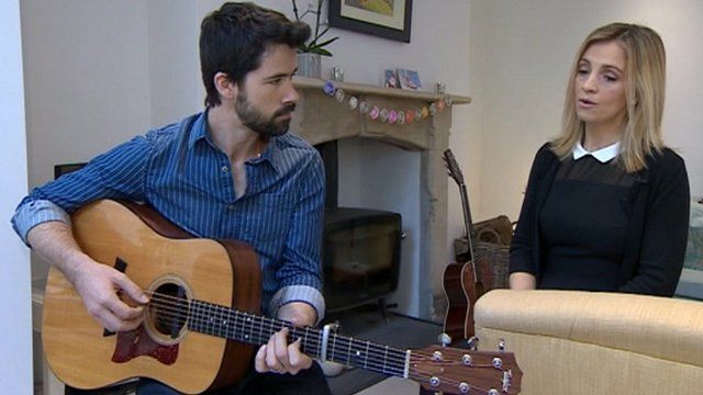 Guitar signed by rock stars sold after being 'lost' for 10 years - BBC News