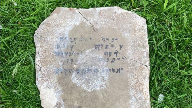 Mystery of inscription found written under Shropshire patio slab - BBC News