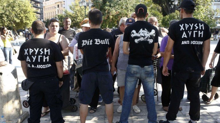 Golden Dawn: Greek police officer held in raid - BBC News