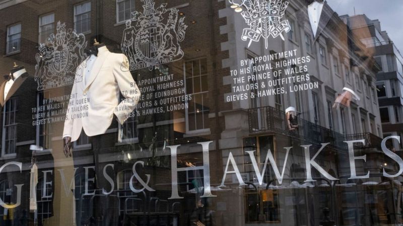 Sports Direct owner buys historic Savile Row tailor - BBC News