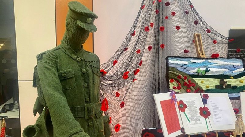 Life-sized remembrance soldier created by knitters - BBC News