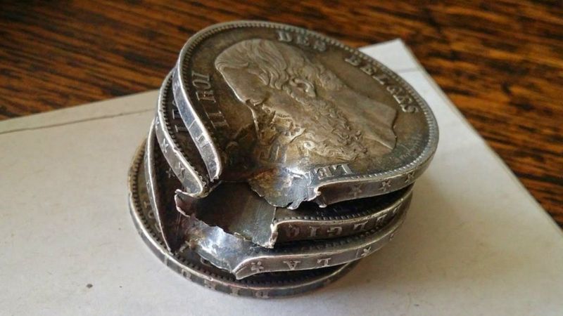 These coins stopped a bullet and saved a soldier's life - BBC News