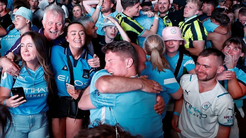 Manchester City fans and players celebrate historic Treble in the rain ...