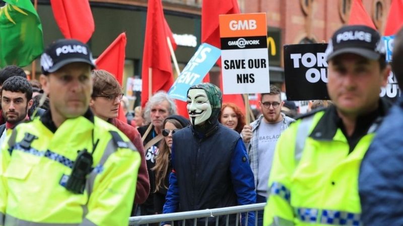 Tories greeted by large protests in Manchester - BBC News