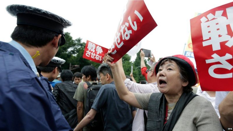 Japan military legislation changes draw protests - BBC News